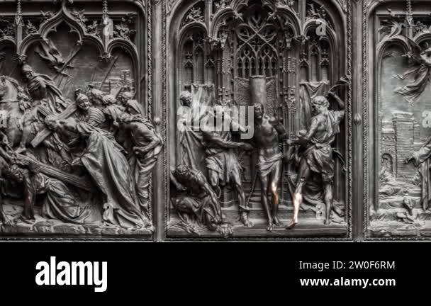 Beautiful Duomo di Milano iron gates decor in close up.Jesus Christ ...