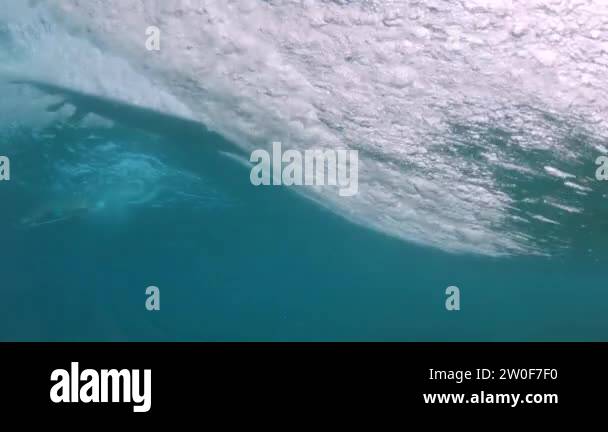SLOW MOTION, UNDERWATER: Powerful deep blue barrel wave pushes ...