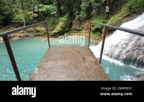 Walking down and looking over the edge of jumping platform overlooking ...