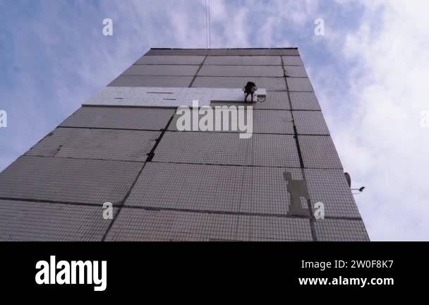 Industrial Climber Insulation of Facade Old High-Rise Building Using ...
