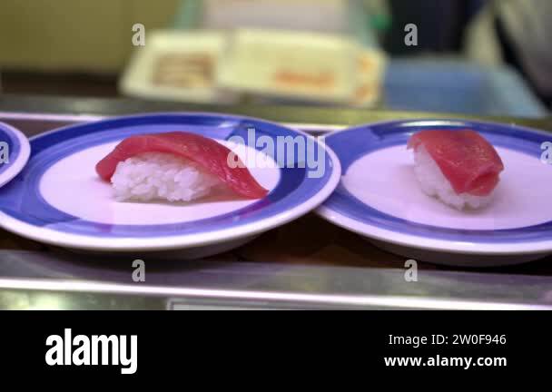 Slow motion of sushi on moving conveyor belt in a Japan restaurant ...