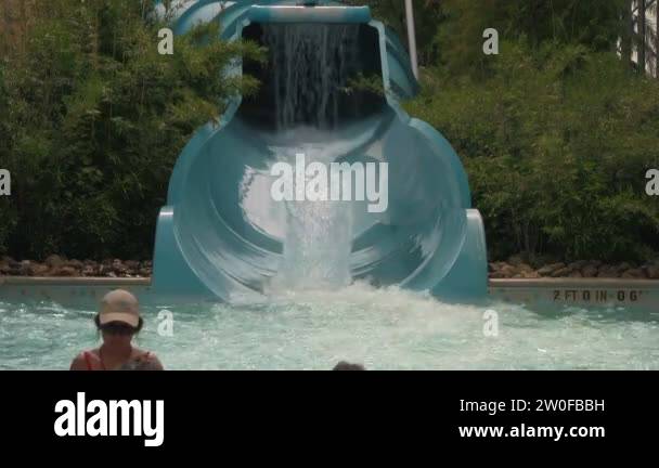 People Enjoy Sliding Down a Big Tube Water Slide at Aquatica Water Park ...