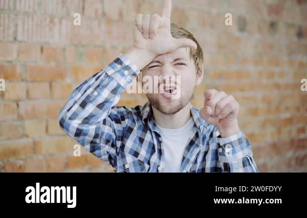 Loser sign Stock Videos & Footage - HD and 4K Video Clips - Alamy