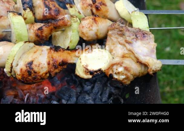 Juicy kebab barbecue on the grill slow motion. Cooking kebabs on ...
