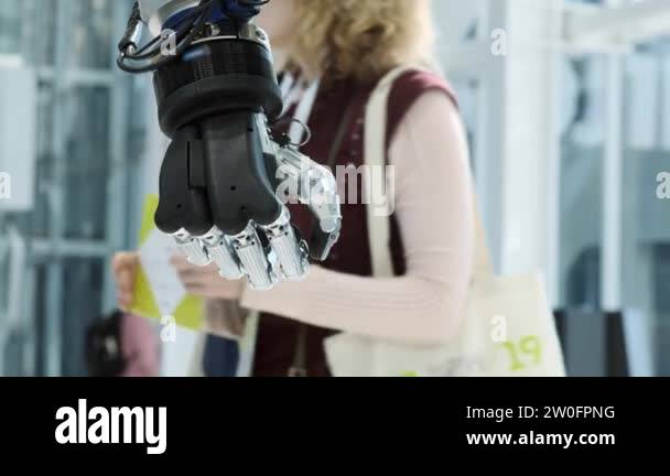 New technologies among us. The hand of the robot takes a soft toy in ...