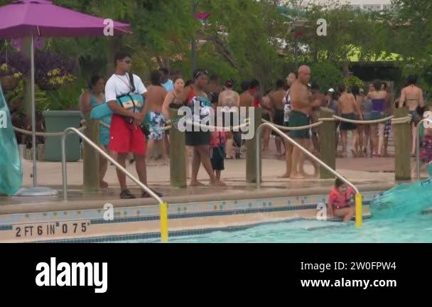 On Duty Lifeguard at a Waterpark Tube Slide Swimming Pool Attraction in ...