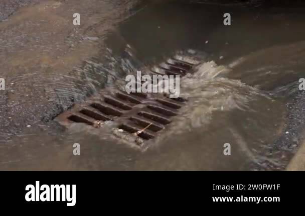 water drains into the sewer during rain through the iron grid Stock ...