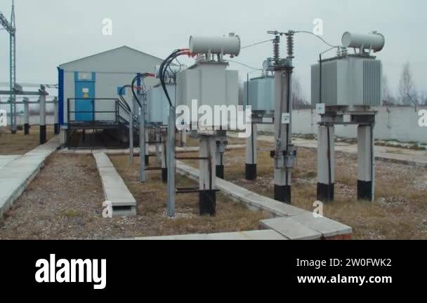 High voltage substation 110 kV with tall pylons and hog voltage ...