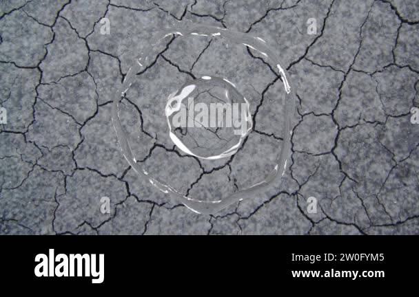 3D rendring of water forming a ring around big drop on dry soil ...