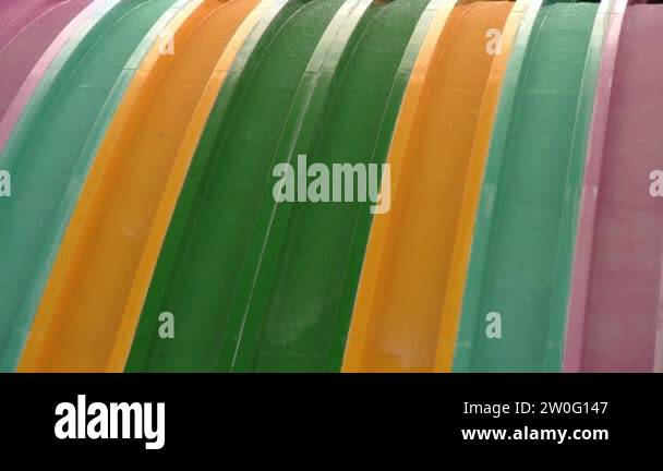 Screaming Water Park Visitors Racing Down Colorful Speed Slides at ...