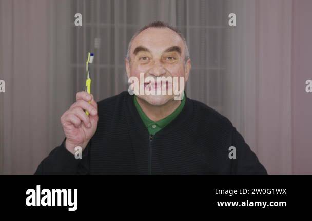 A man with bad teeth.A man with an ugly smile smiles. A man shows his ...