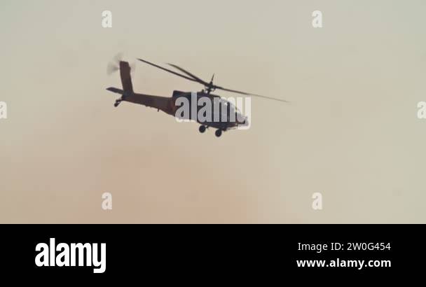 AH-64D Apache Longbow military helicopter during combat flight Stock ...