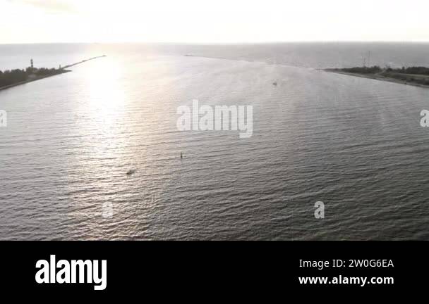 Aerial: Beautiful 4K following a small boat water transport - a bird ...