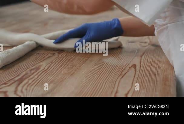 Details in a big bakery factory baking bread process people working on ...