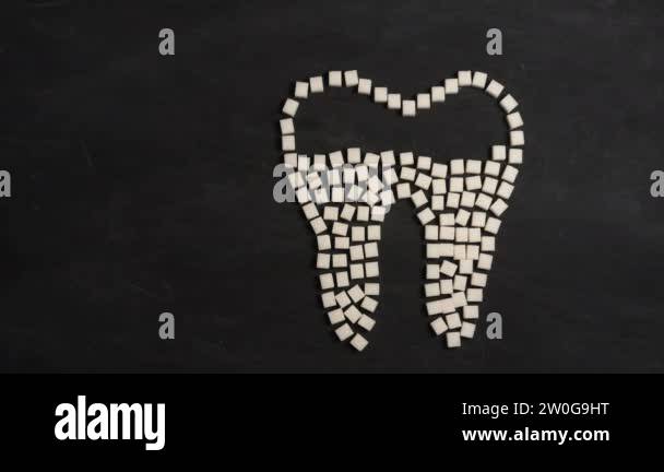 Sugar destroy tooth enamel leads tooth decay Sugar cubes form tooth on ...
