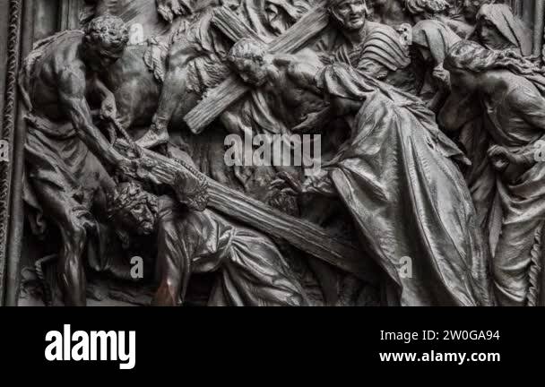 Beautiful Duomo di Milano iron gates decor in close up.Jesus Christ ...