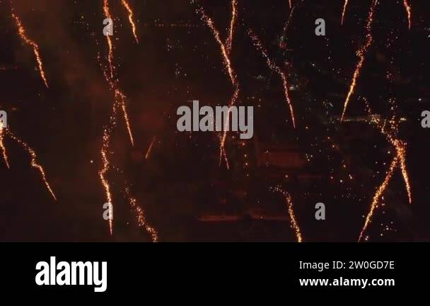 Bright firework explosion in the night sky. Fireworks salute with the ...