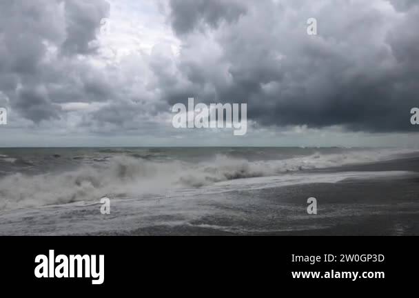 Storm at sea, storm warning on the coast. Thunderclouds and big sea ...