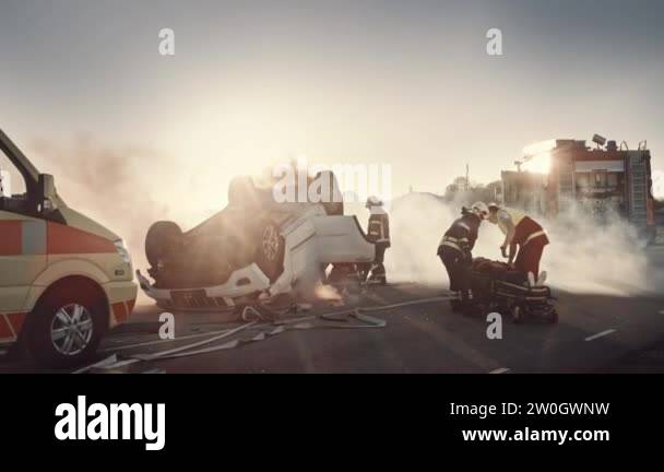 On the Car Crash Traffic Accident Scene: Rescue Team of Firefighters ...