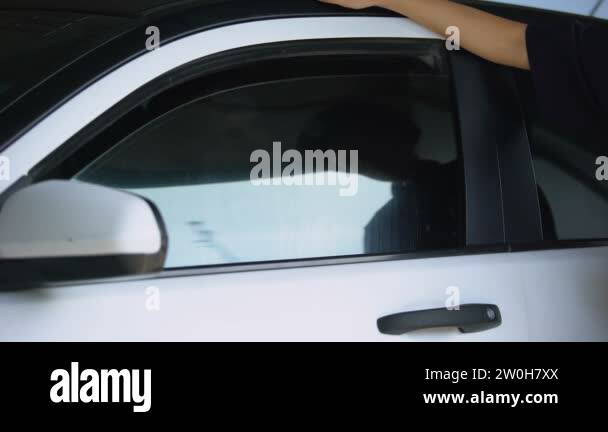 Police woman knocking car window, checking drivers license, road ...