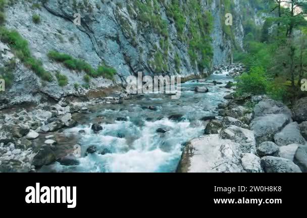 Aerial 4k Top view of a mountain river. Alpine river flows in a gorge ...