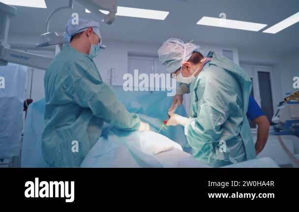 Stem cells injection procedure. Surgeon holding big syringe and ...