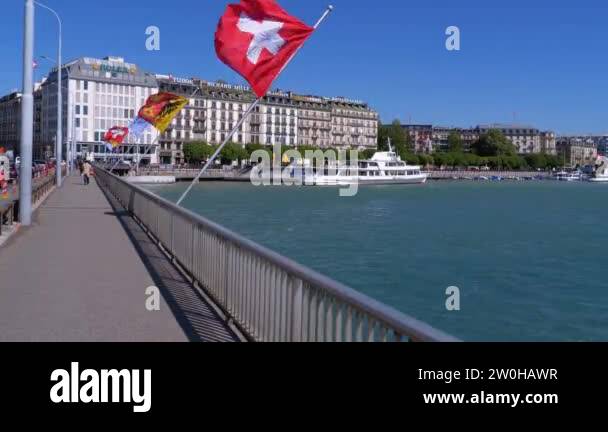 Mont-Blanc Bridge. Central bridge over the Geneva lake with the flags of the countries ...