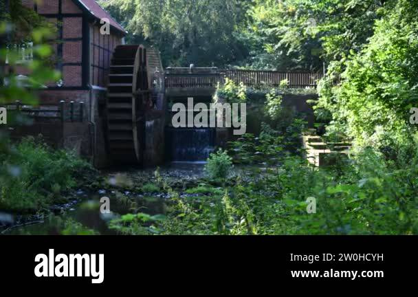 At the Huder monastery ruins there is a stream with a water wheel and a ...