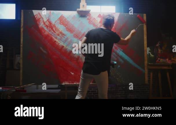Talented Male Artist Working on a Abstract Painting, Uses Industrial ...