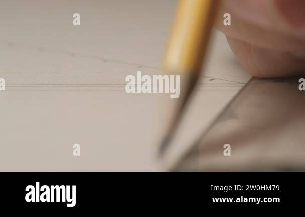 Close-up of male architect hands drawing a line on white paperboard ...