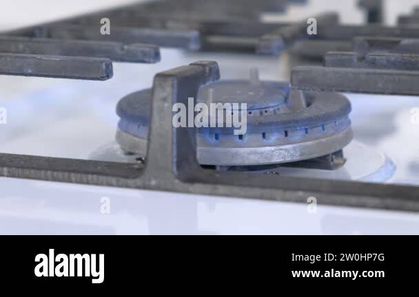 Burning big gas burner from a kitchen gas stove. Gas stove with lattice ...