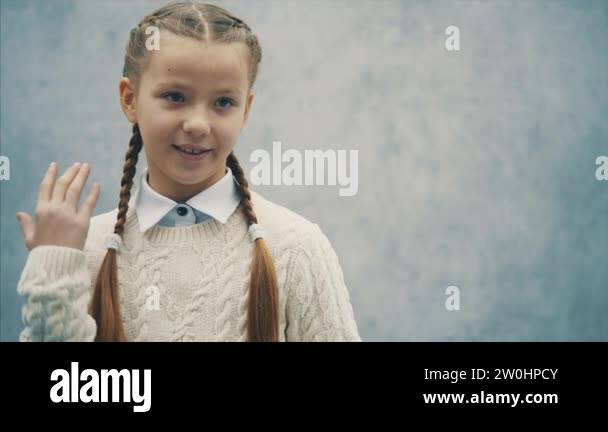 Schoolgirl is telling a story with excited face expression Stock Video ...