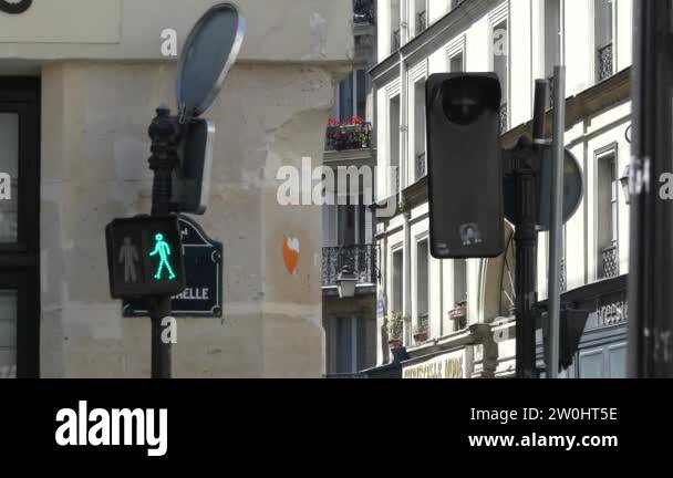 Paris, France - May 2019: Red (Green) traffic light for a pedestrian. A ...