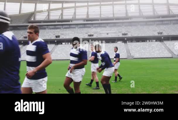 Front view of diverse rugby players playing rugby match in stadium ...