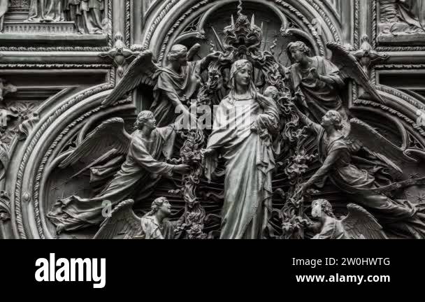 Beautiful Duomo di Milano iron gates decor in close up.Jesus Christ ...