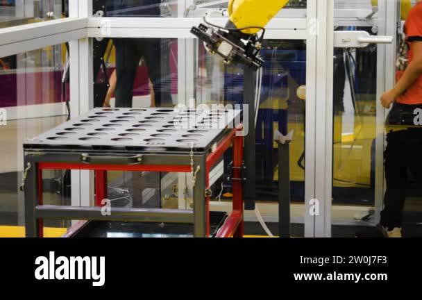 Robotic sorting system. Media. Gripper on universal robot is sorting details in smart warehouse ...