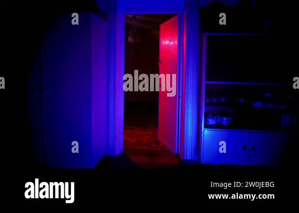 Red light flickers in an empty room. Crime scene. Fear of loneliness ...