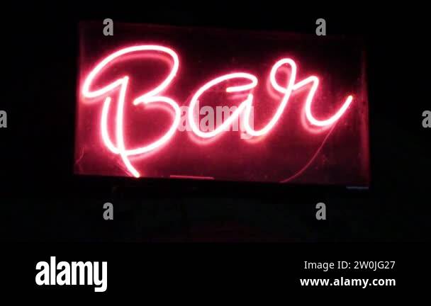 Neon sign Bar in red color sliding, neon symbol for beer and alcohol ...