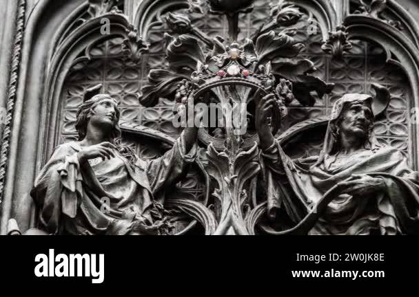 Beautiful Duomo di Milano iron gates decor in close up.Jesus Christ ...