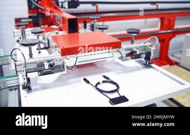 production of solar panels, Industrial robot working in factory ...