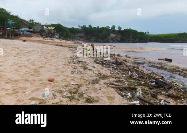 Plastic Pollution. Cleaning Up Ocean Beach From Waste. Young Woman And ...