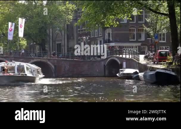 Amsterdam with its traditional Canal system and many bridges used by ...