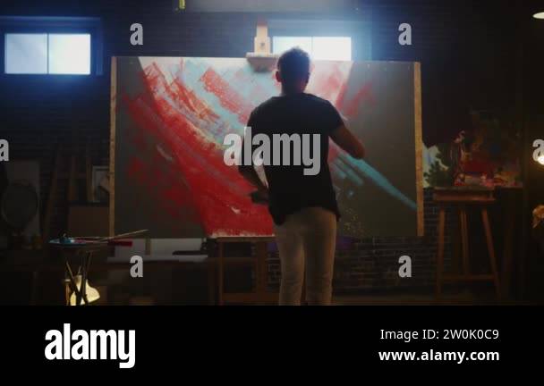 Talented Male Artist Working on a Abstract Painting, Uses Industrial ...