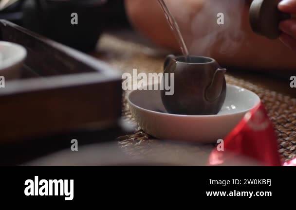 Traditional Chinese gongfu or kung fu tea ceremony. Boiling water pours ...