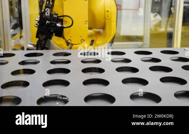 Robotic sorting system. Media. Gripper on universal robot is sorting details in smart warehouse ...