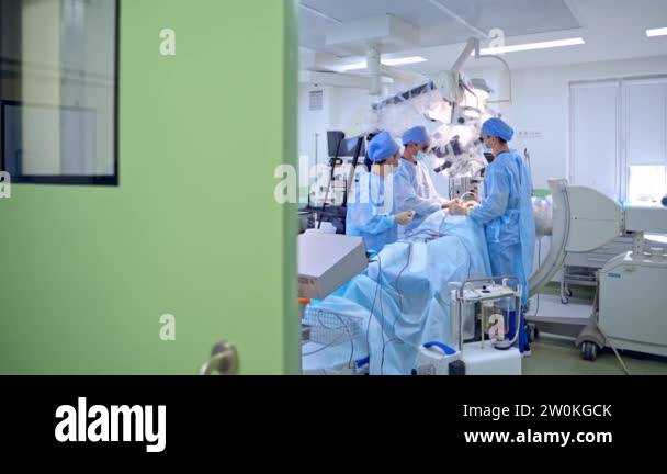 Operating process in a modern surgery room. Teamwork of professional ...