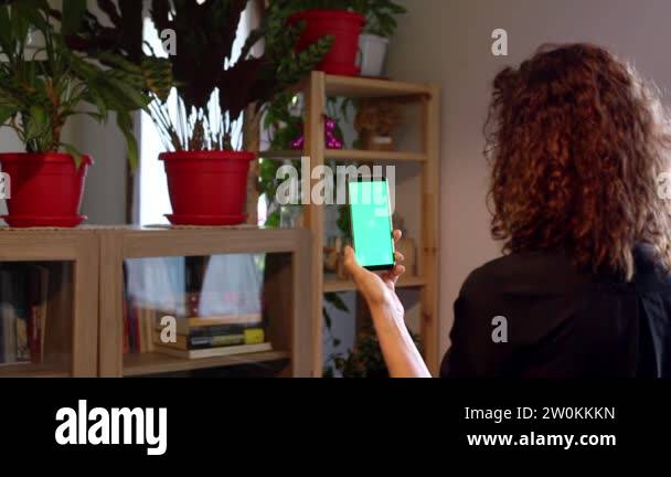 Woman on a room interact with a HUD hologram green screen Stock Video ...