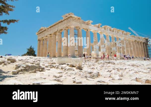 The Parthenon at the Acropolis in Athens Greece Side Angle View with Visitors Sightseeing the ...