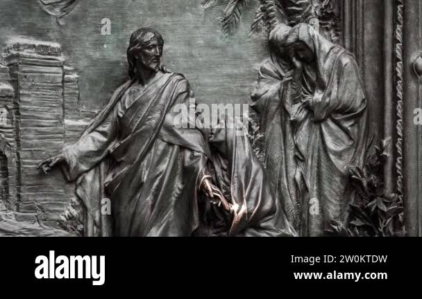 Beautiful Duomo di Milano iron gates decor in close up.Jesus Christ ...