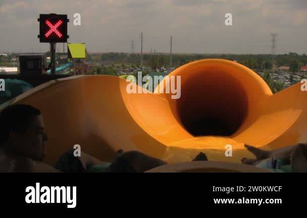 People Starting a Water Tube Slide with a Safety Light Indicating that ...